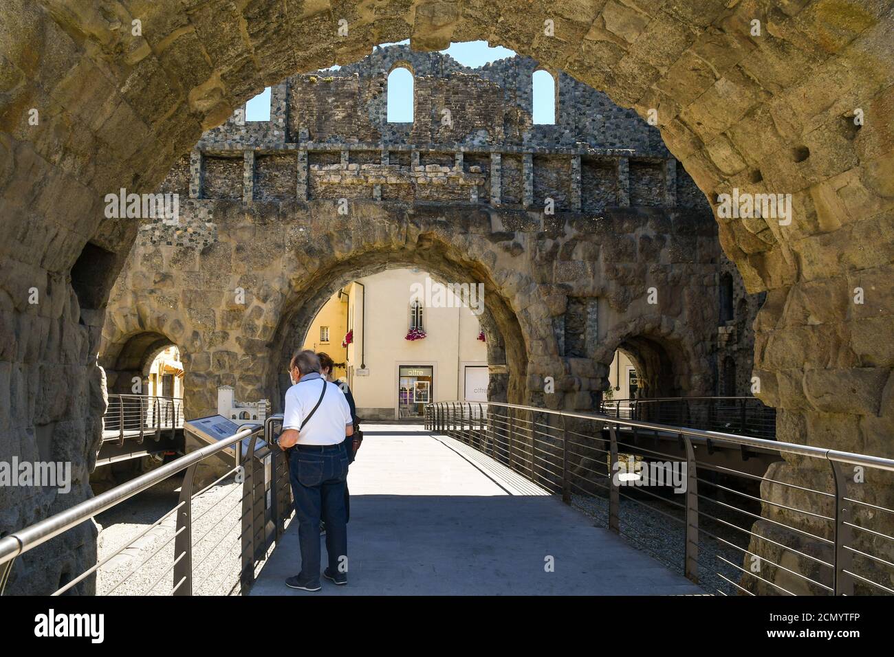 A couple of tourists looking at the tactile model of the Roman era ...