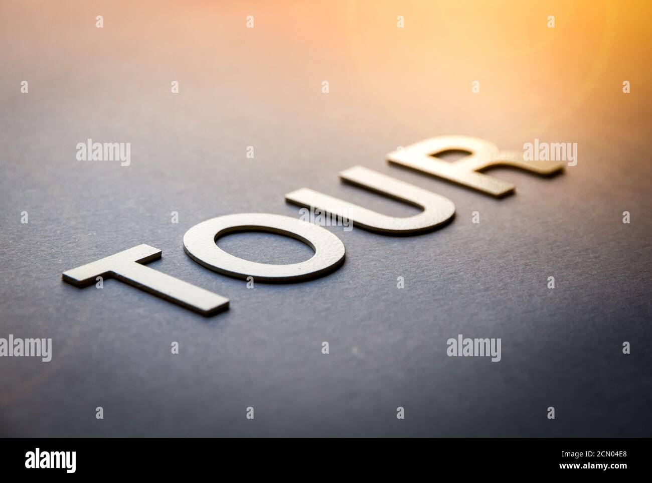 Word tour written with white solid letters Stock Photo - Alamy