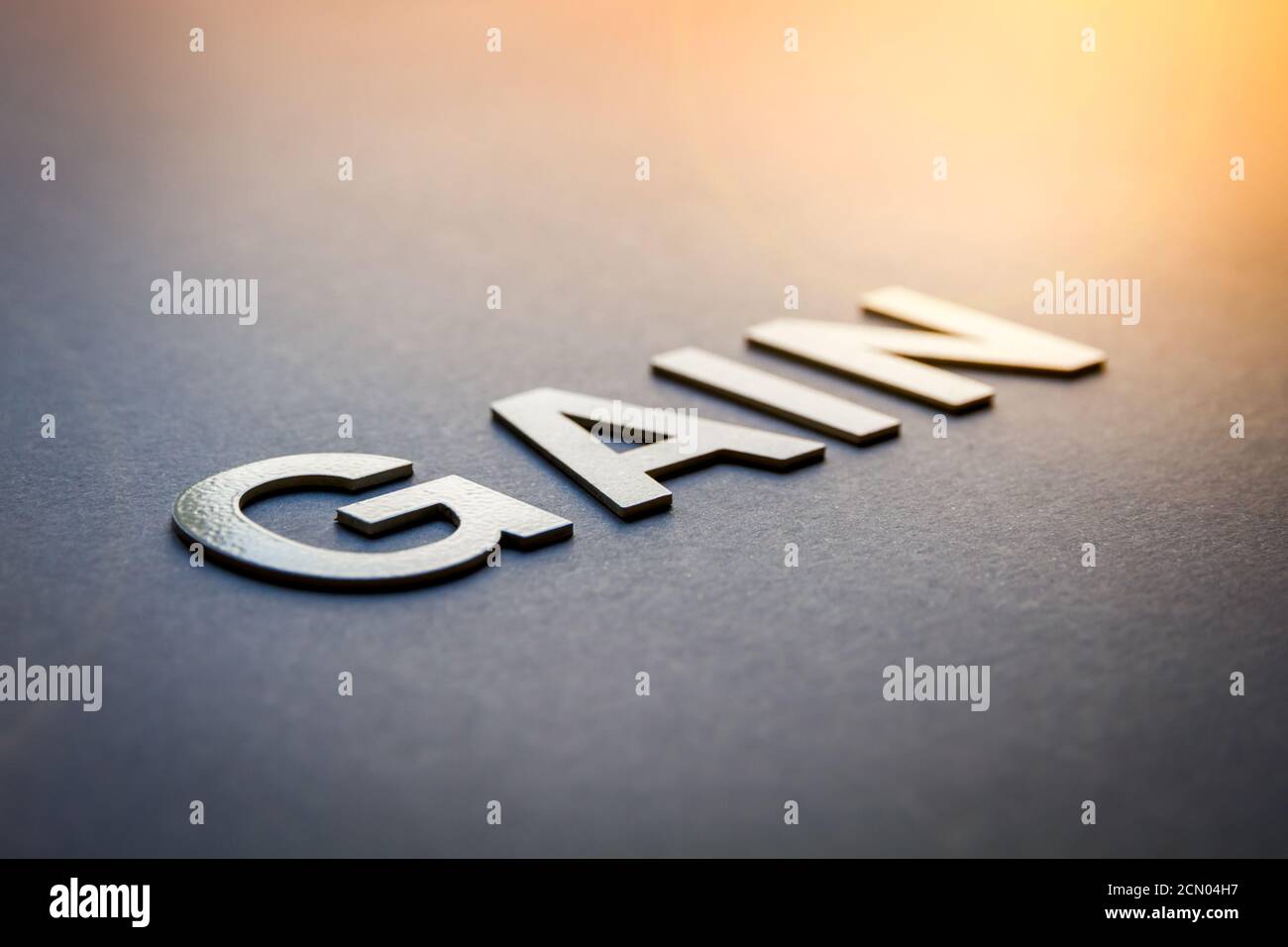 Word gain written with white solid letters Stock Photo - Alamy