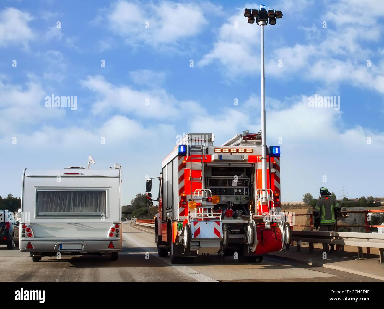 Fire truck with extended lighting mast on the highway in Germany ...
