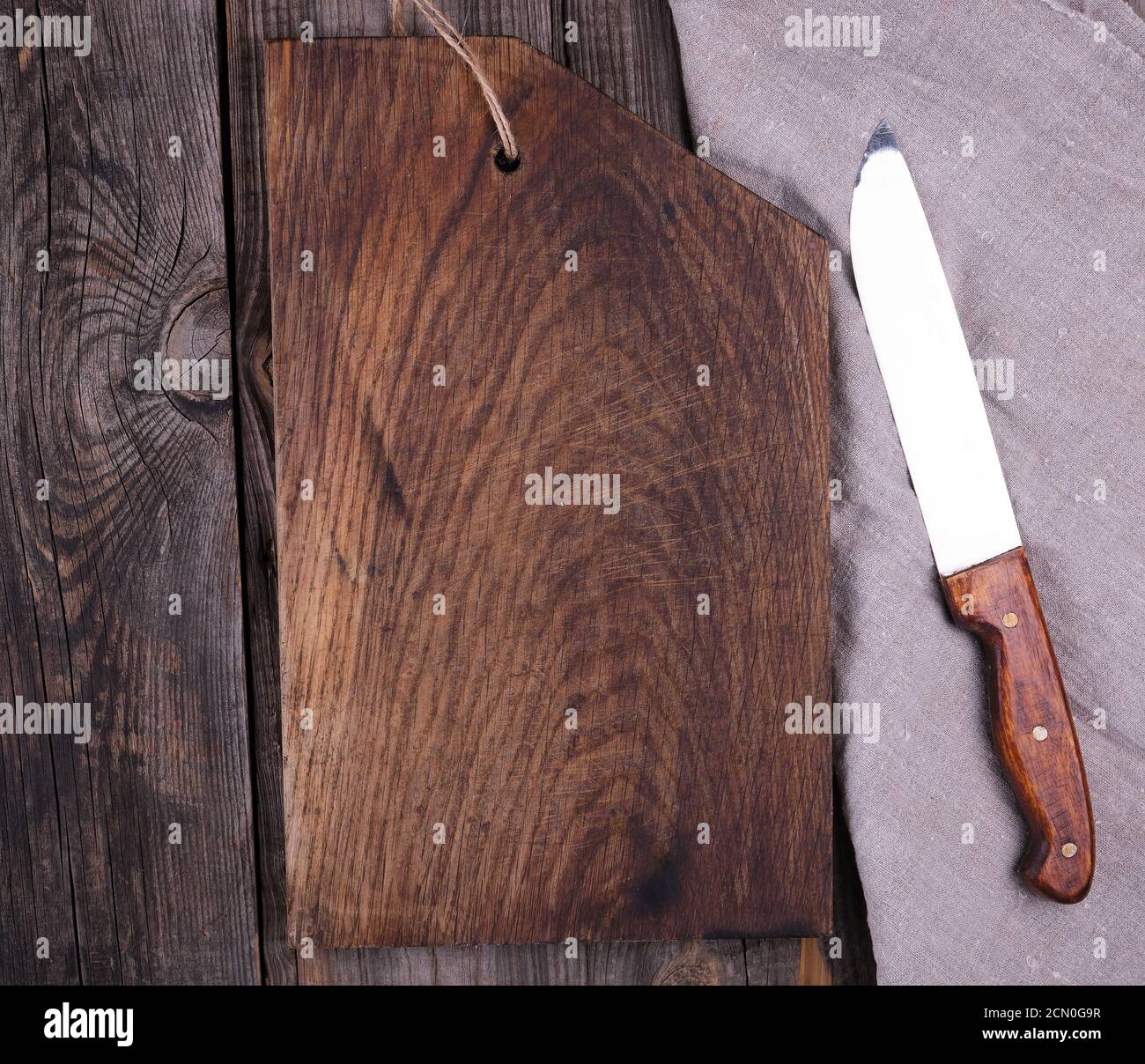 very old empty wooden rectangular cutting board and knife, top view ...