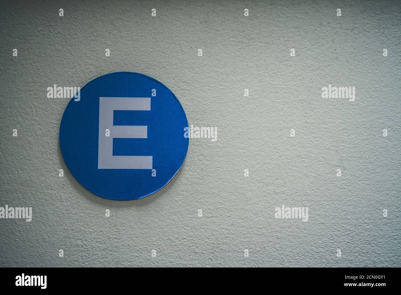 Blue E train subway sign in New York City. Letter E Stock Photo - Alamy