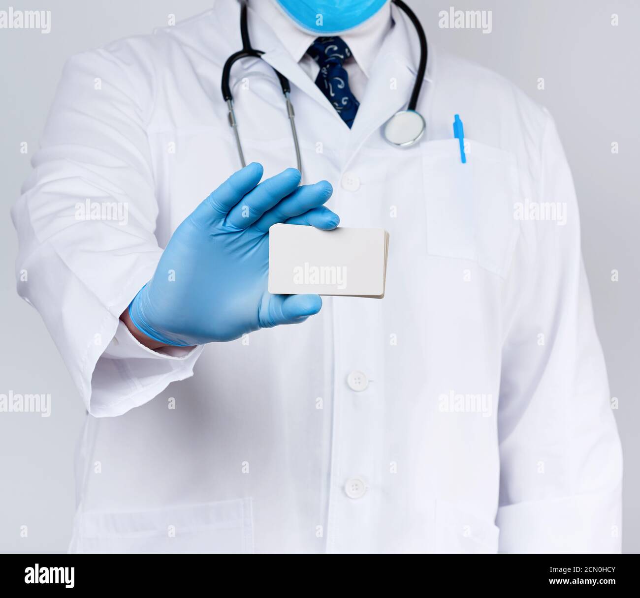 adult doctor therapist is dressed in a white robe uniform and blue ...