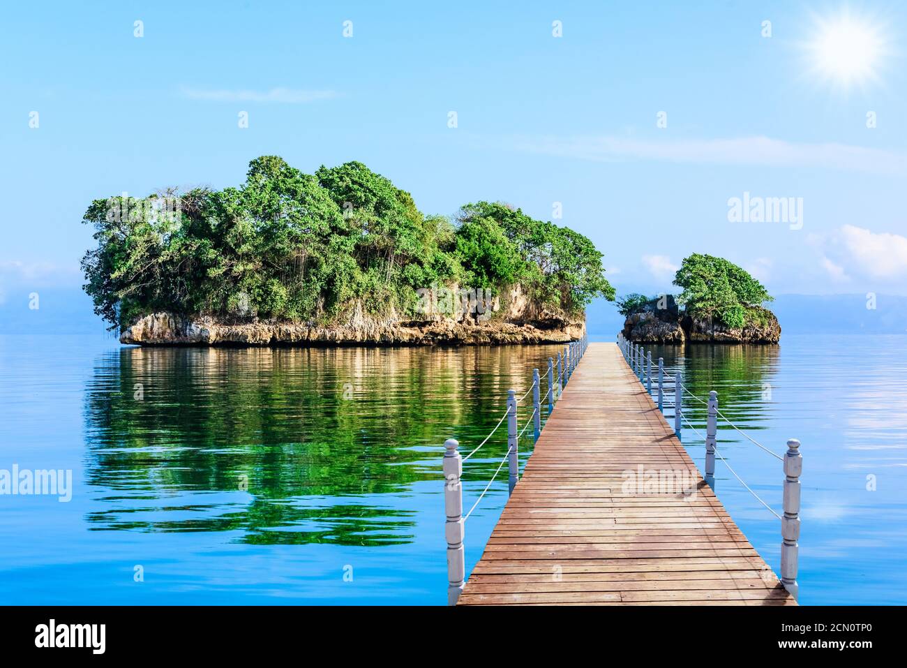 beautiful flying island covered with greenery into the ocean reflected ...