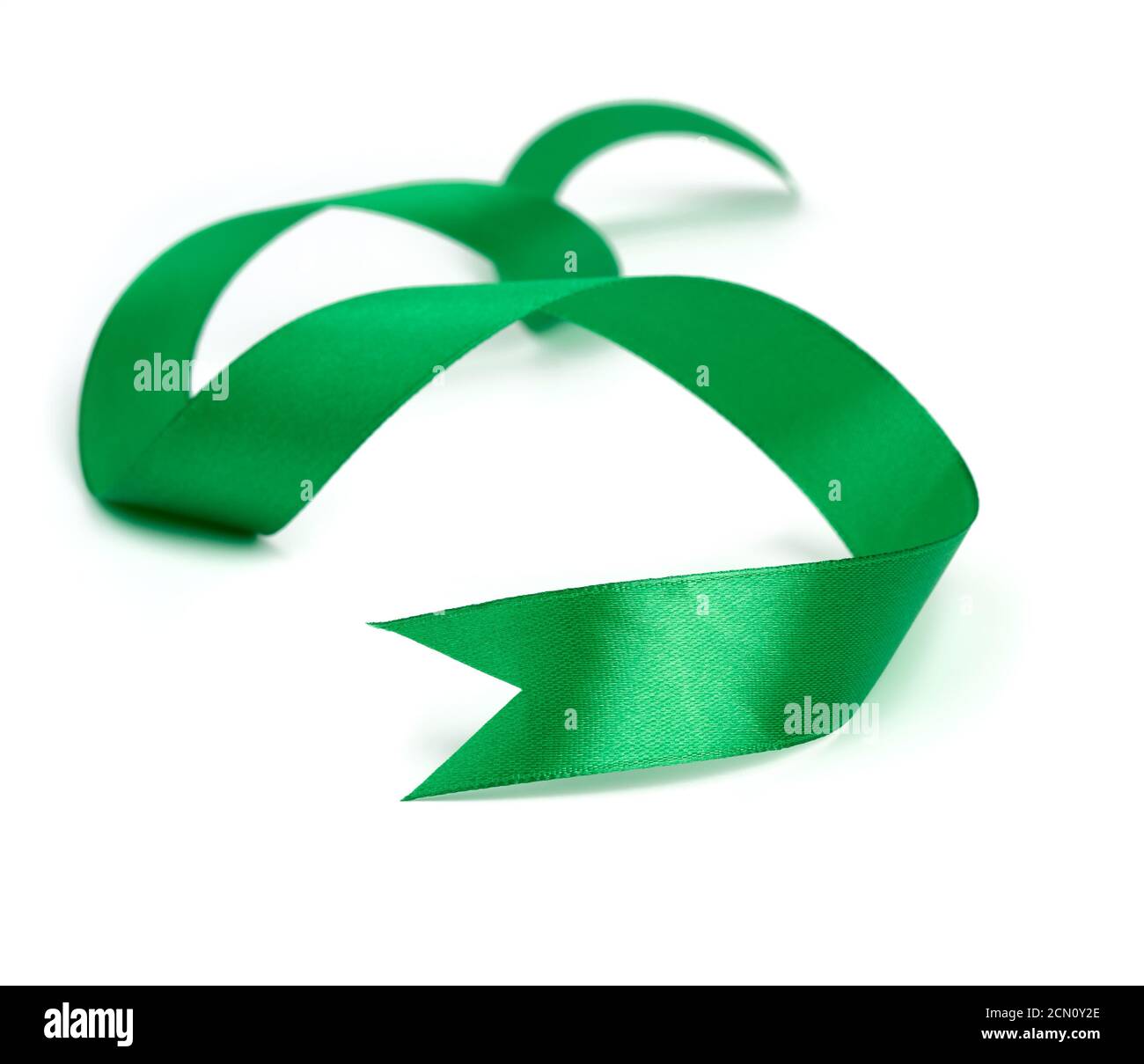 twisted green silk ribbon isolated on white background Stock Photo - Alamy