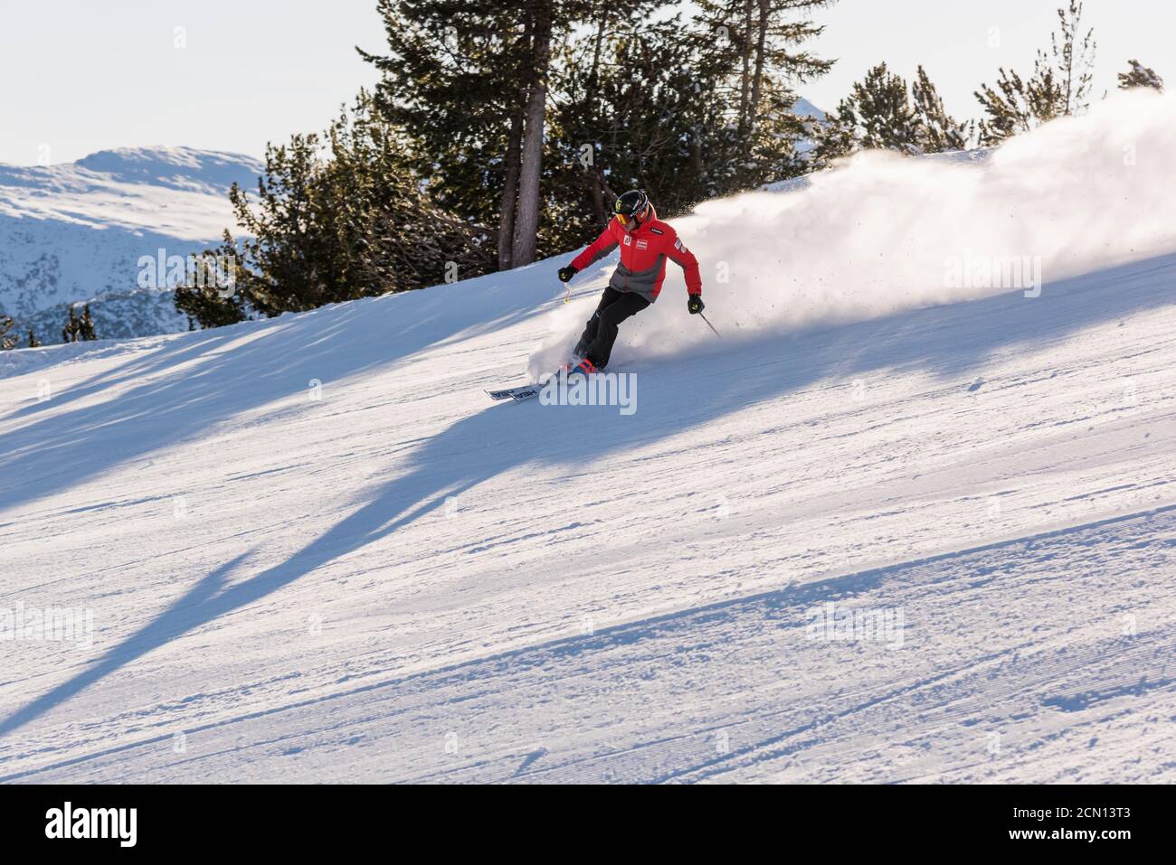 Skier going down slope hi-res stock photography and images - Alamy