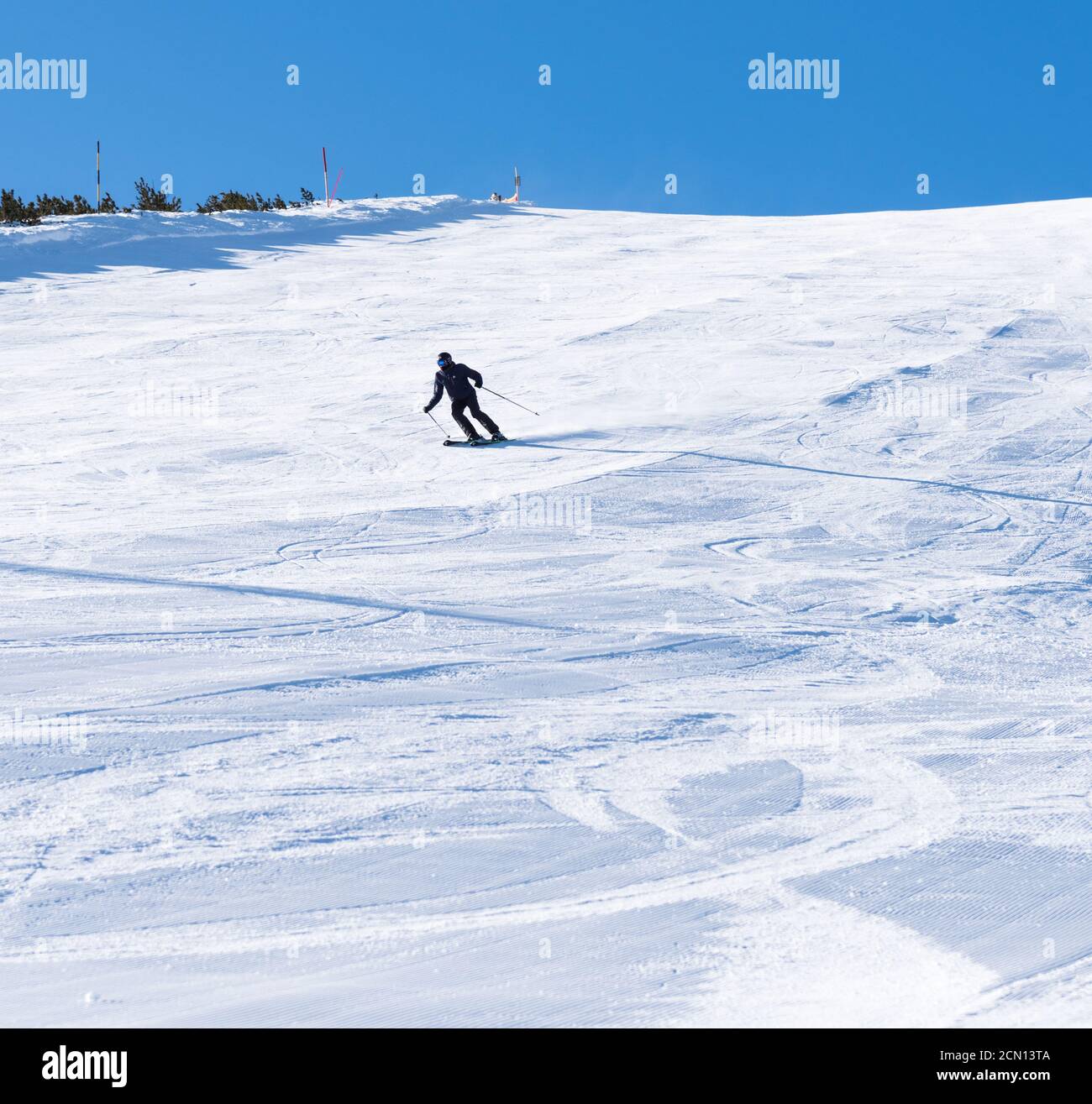 Skier going down slope hi-res stock photography and images - Alamy