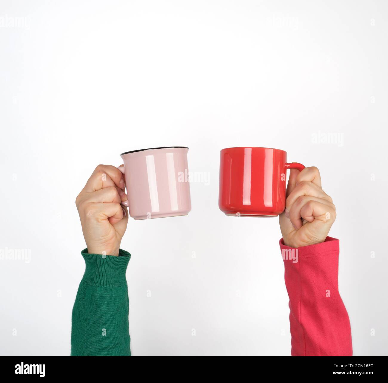 Woman holding mug two hands hi-res stock photography and images - Alamy