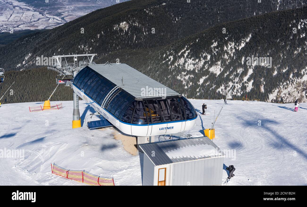 Snowy ski slopes and chair ski lifts station in mountain ski resort ...