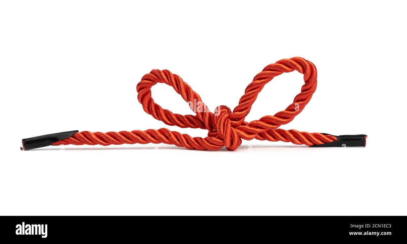 red twisted lace from silk threads is isolated on a white background ...