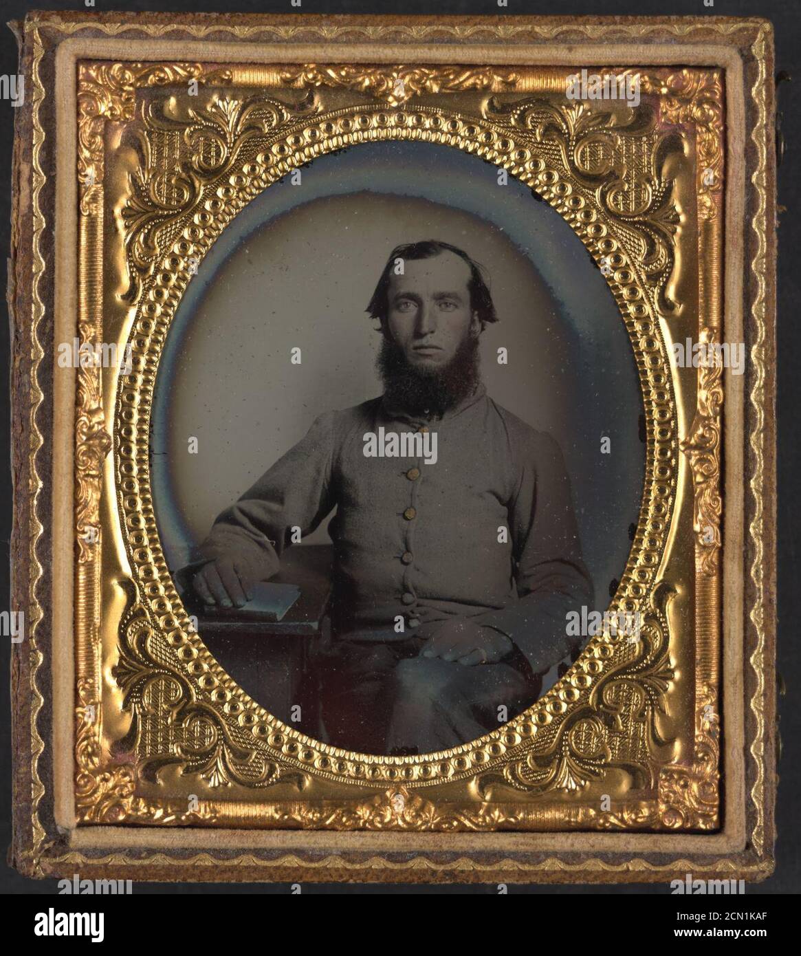 Joshua Whitten of 45th North Carolina Infantry Regiment seated at a ...