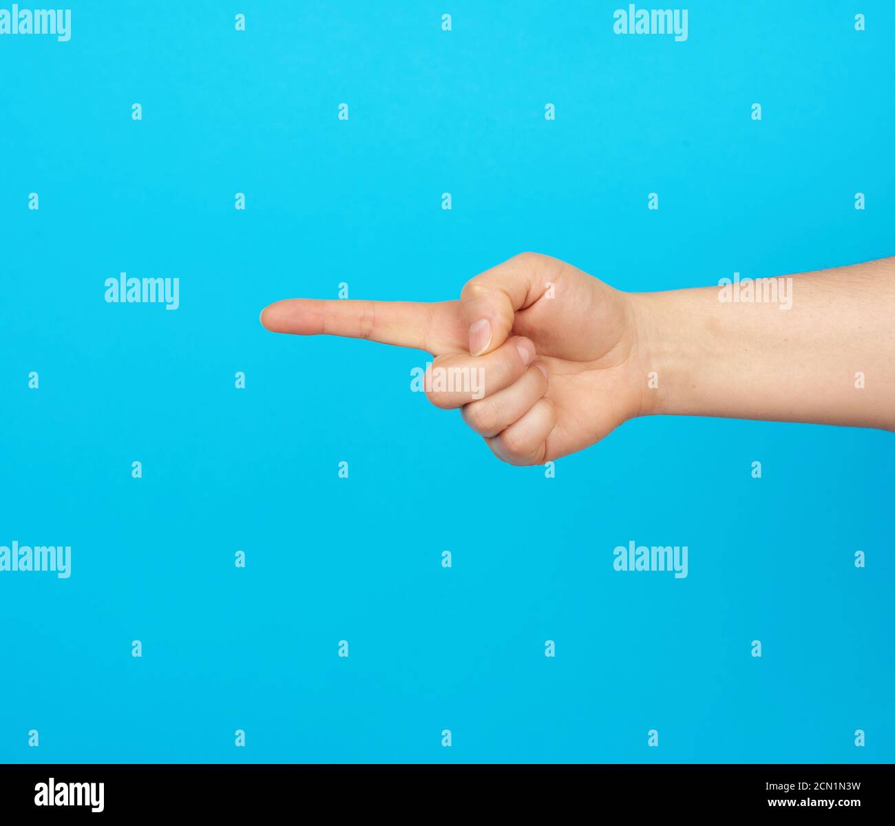 hand shows forefinger gesture on a blue background Stock Photo - Alamy