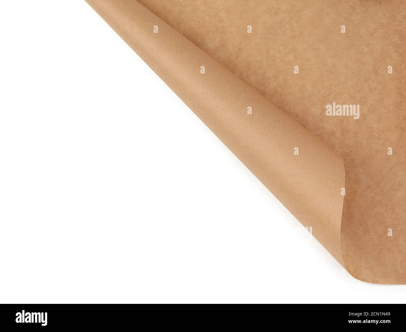 curved edge of a brown parchment paper sheet is isolated on a white ...