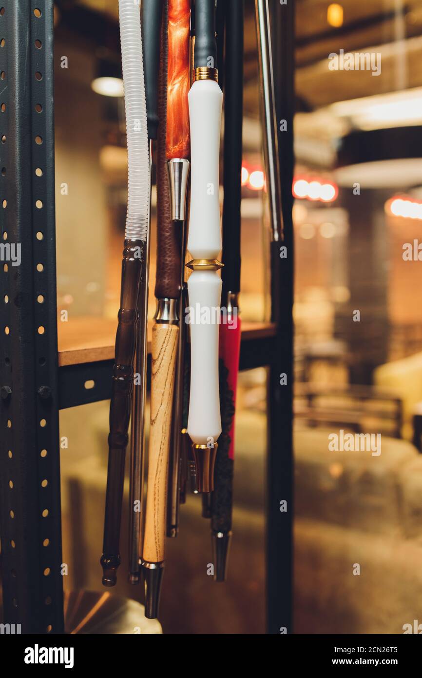 Egyptian hose with mouthpiece for hookah hanging on the rack Stock ...