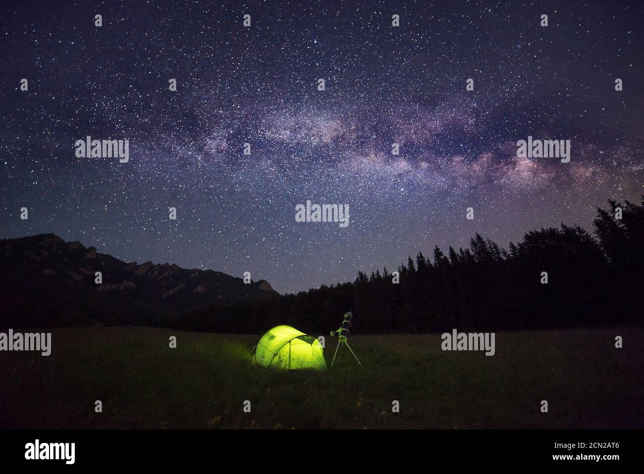 Camping tent at night against amazing sky full of stars and milky-way ...