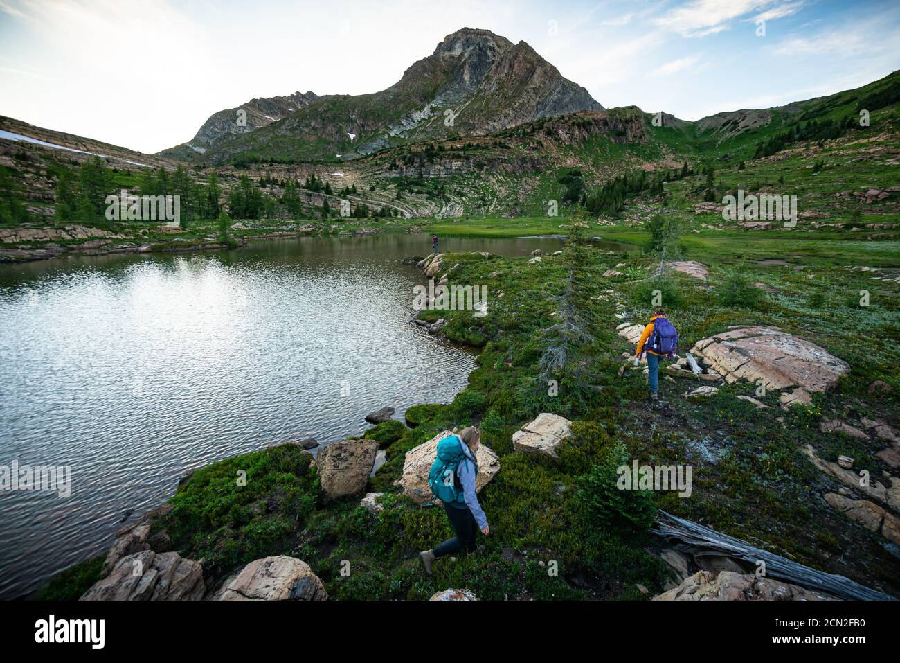 Hikers Walking Around Limestone Lakes in Height of the Rockies Stock ...