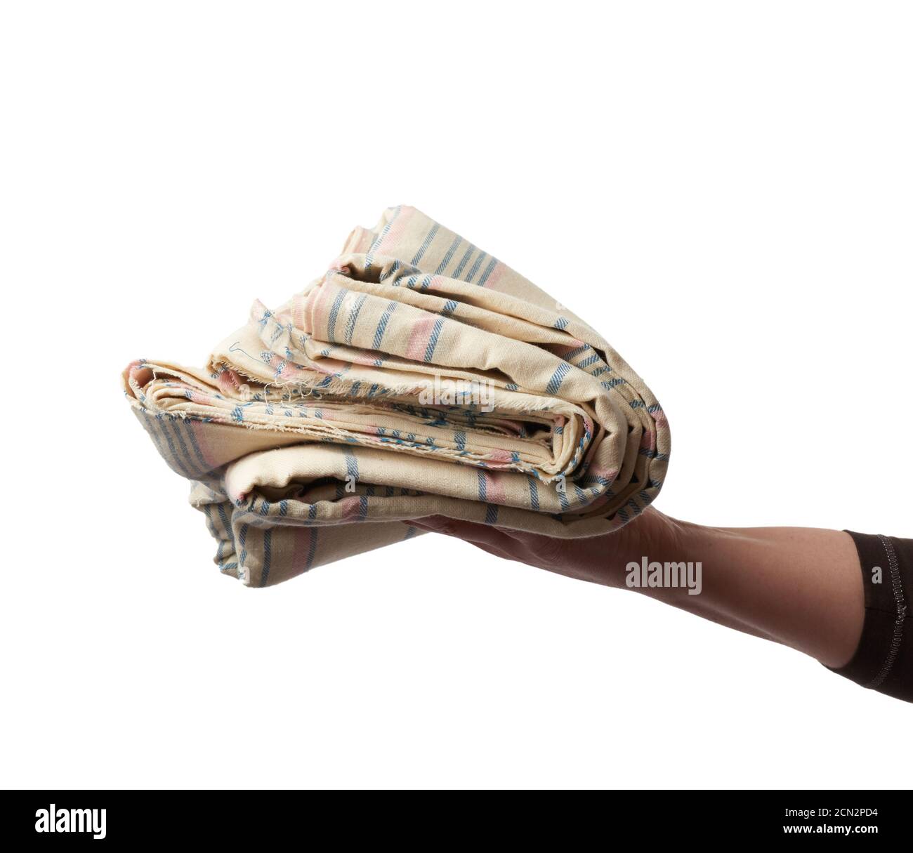 female hand holds folded cotton fabric, isolated white background Stock ...