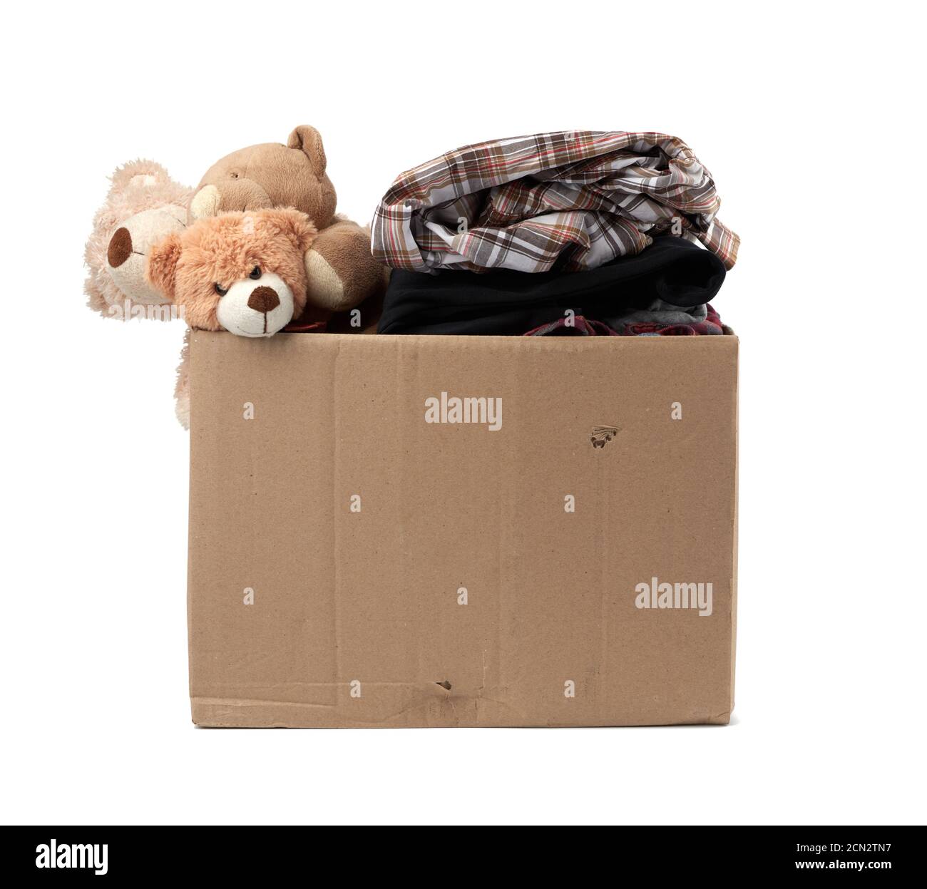 large brown cardboard box filled with things and children's toys ...