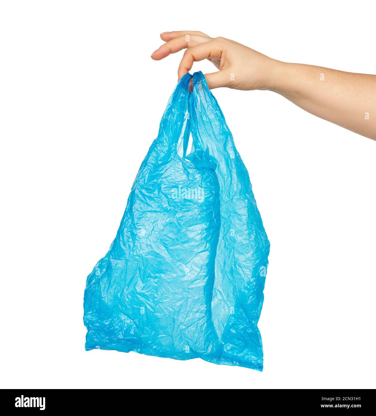 hand holds an empty blue plastic bag on a white background, concept of ...