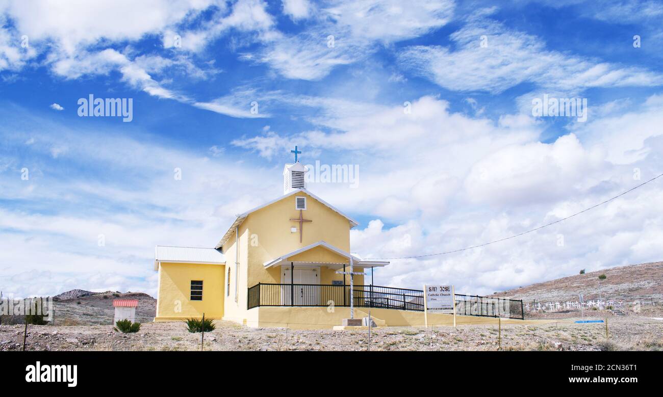 Yellow and white color Church with blue sky behind it Stock Photo - Alamy