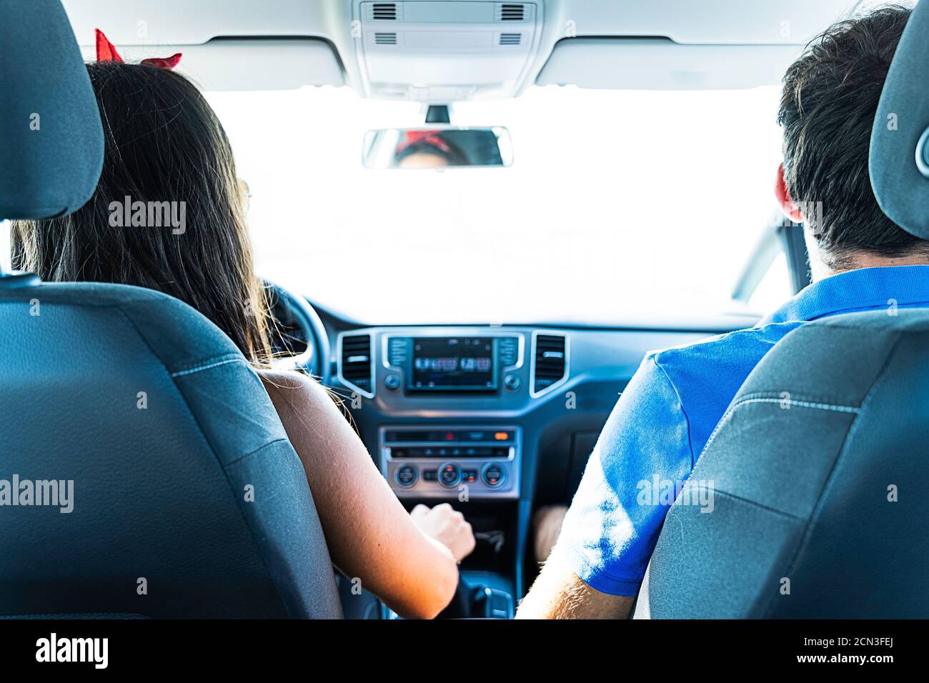 Happy couple driving a car Stock Photo - Alamy
