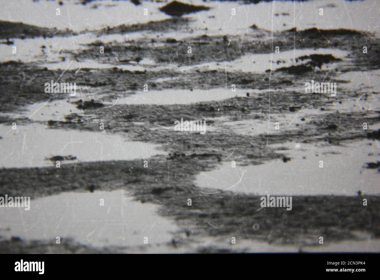 Fine 1970s vintage black and white photography of puddles on the sandy ...