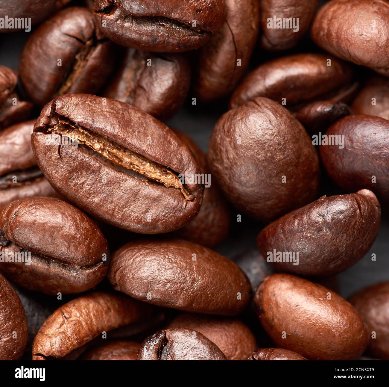 roasted grains of Robusta coffee on a black background, top view Stock ...