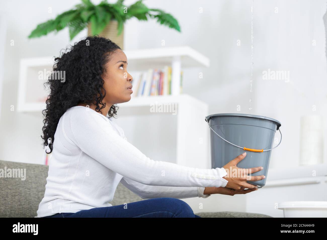Water leaking from bucket hi-res stock photography and images - Alamy