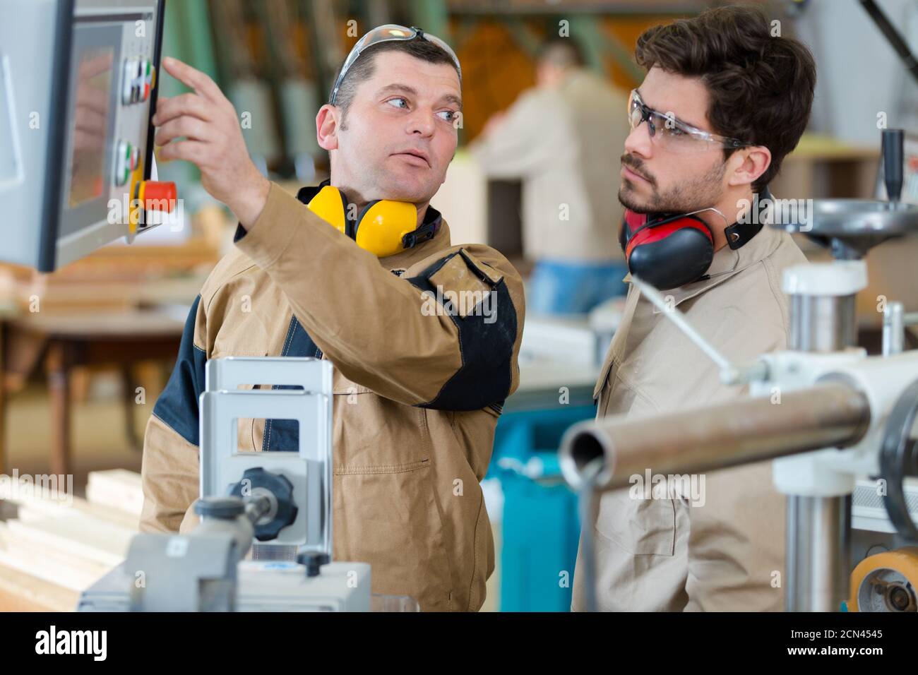 Man operating machines hi-res stock photography and images - Alamy