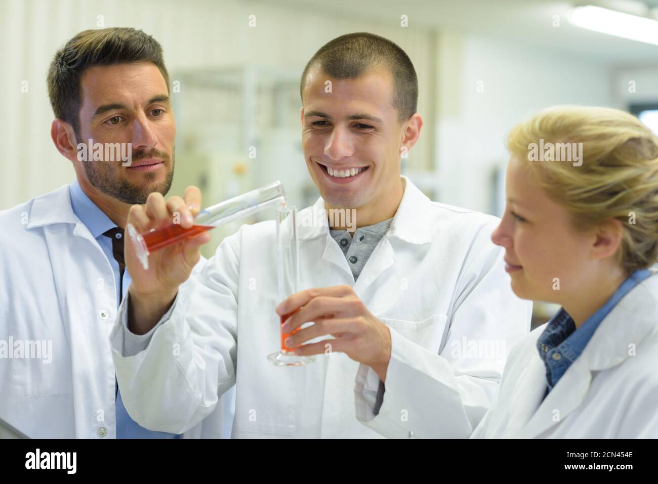 portrait of a lab students having fun Stock Photo - Alamy