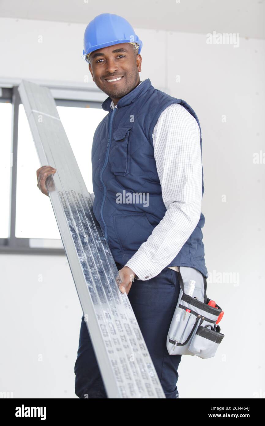 Man carrying metal beam hi-res stock photography and images - Alamy
