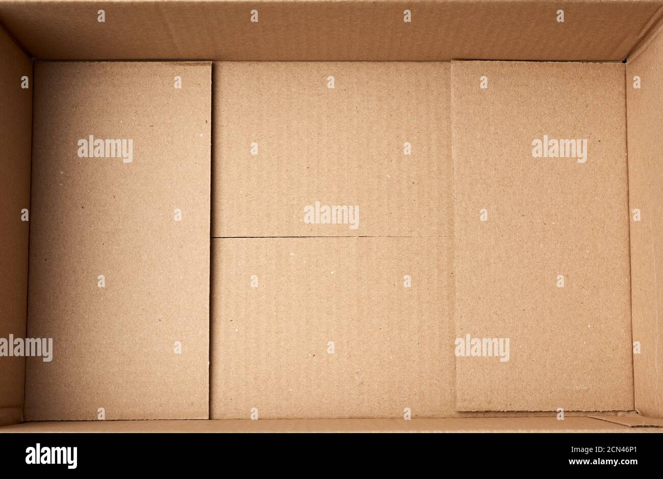 bottom of open empty brown cardboard box, top view Stock Photo - Alamy