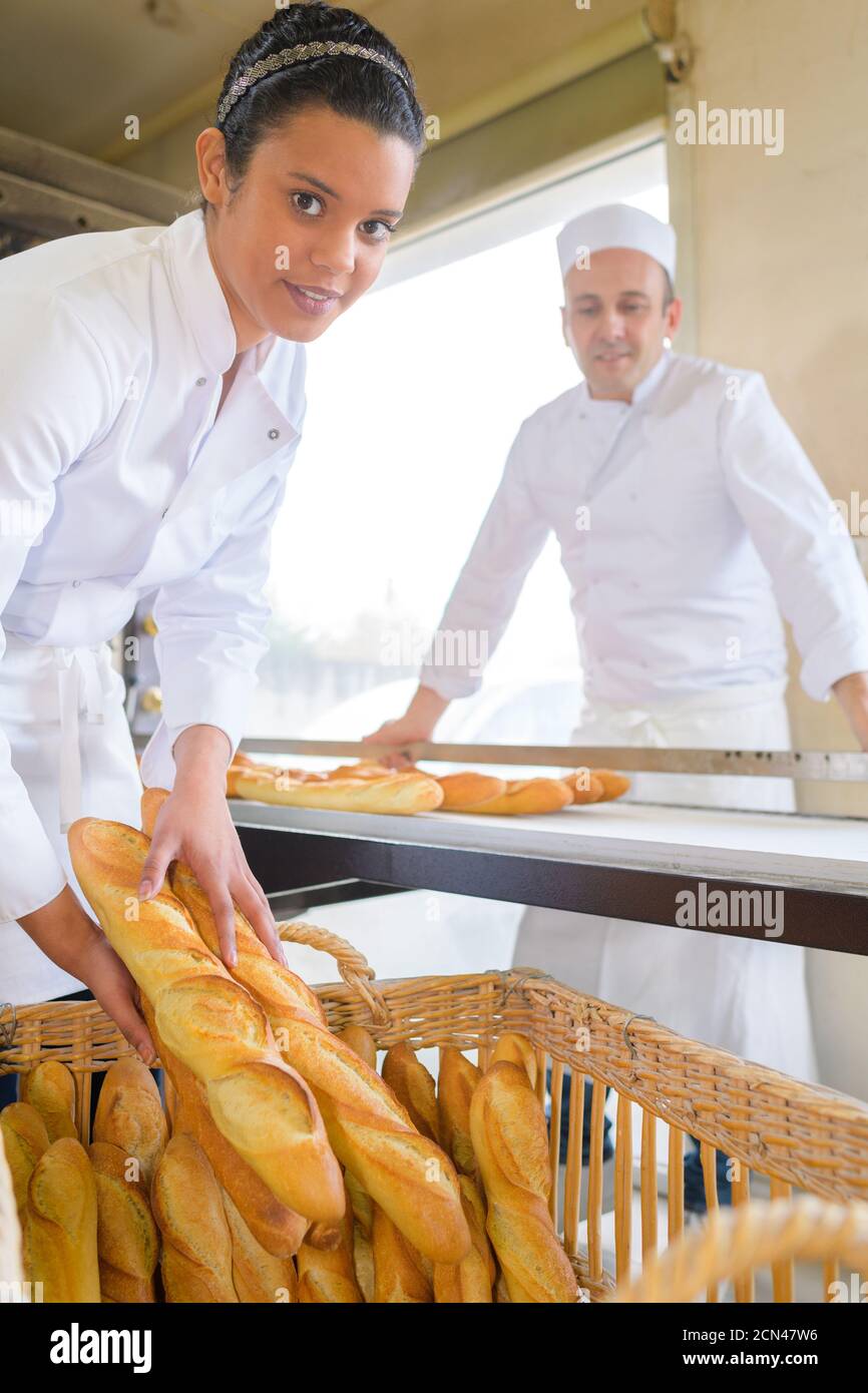 a cheerful female bakery workers Stock Photo - Alamy