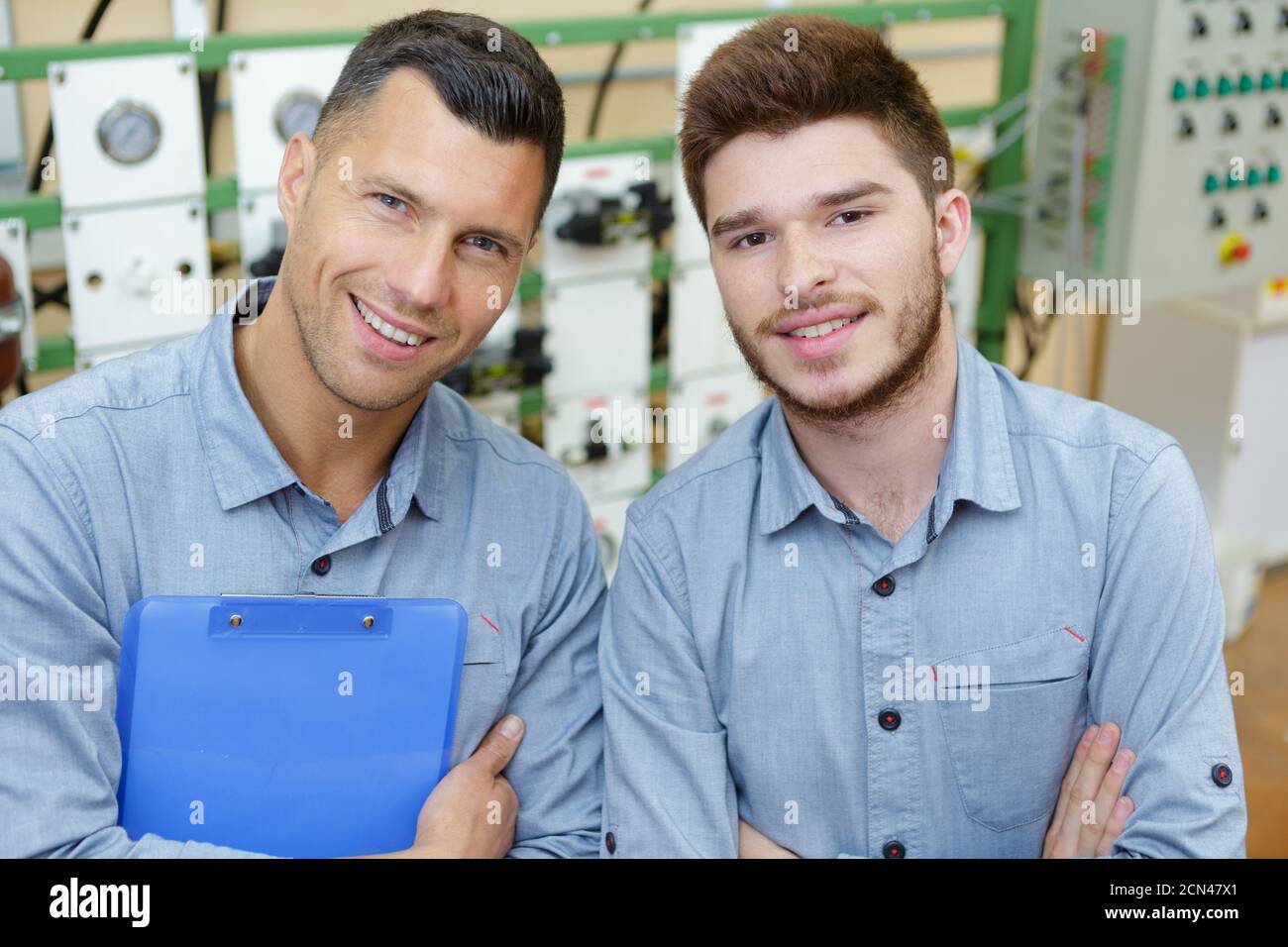 Portrait two men fixing hi-res stock photography and images - Alamy