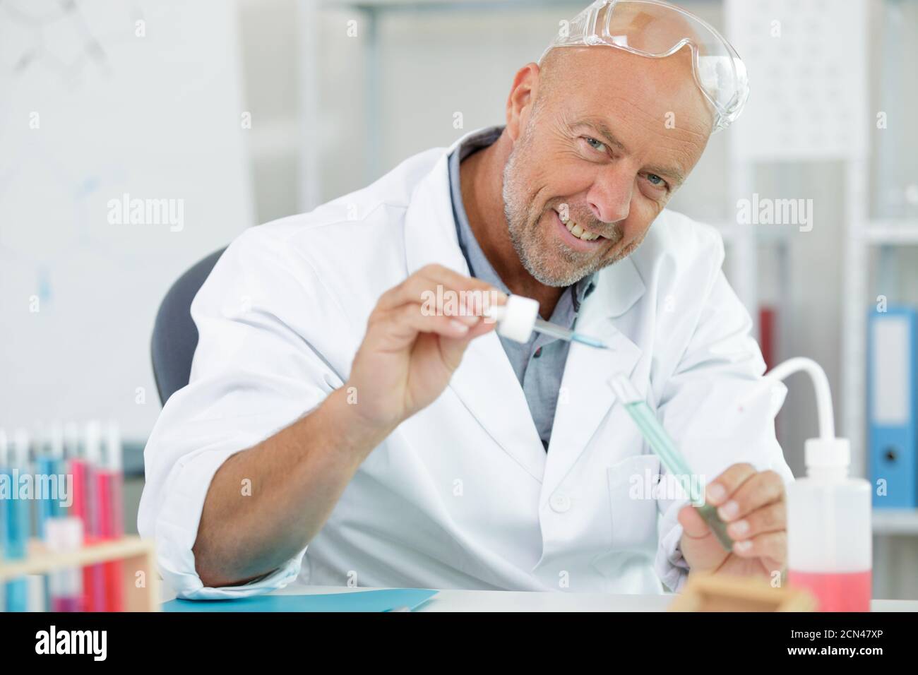 senior scientist smiling at the camera Stock Photo - Alamy