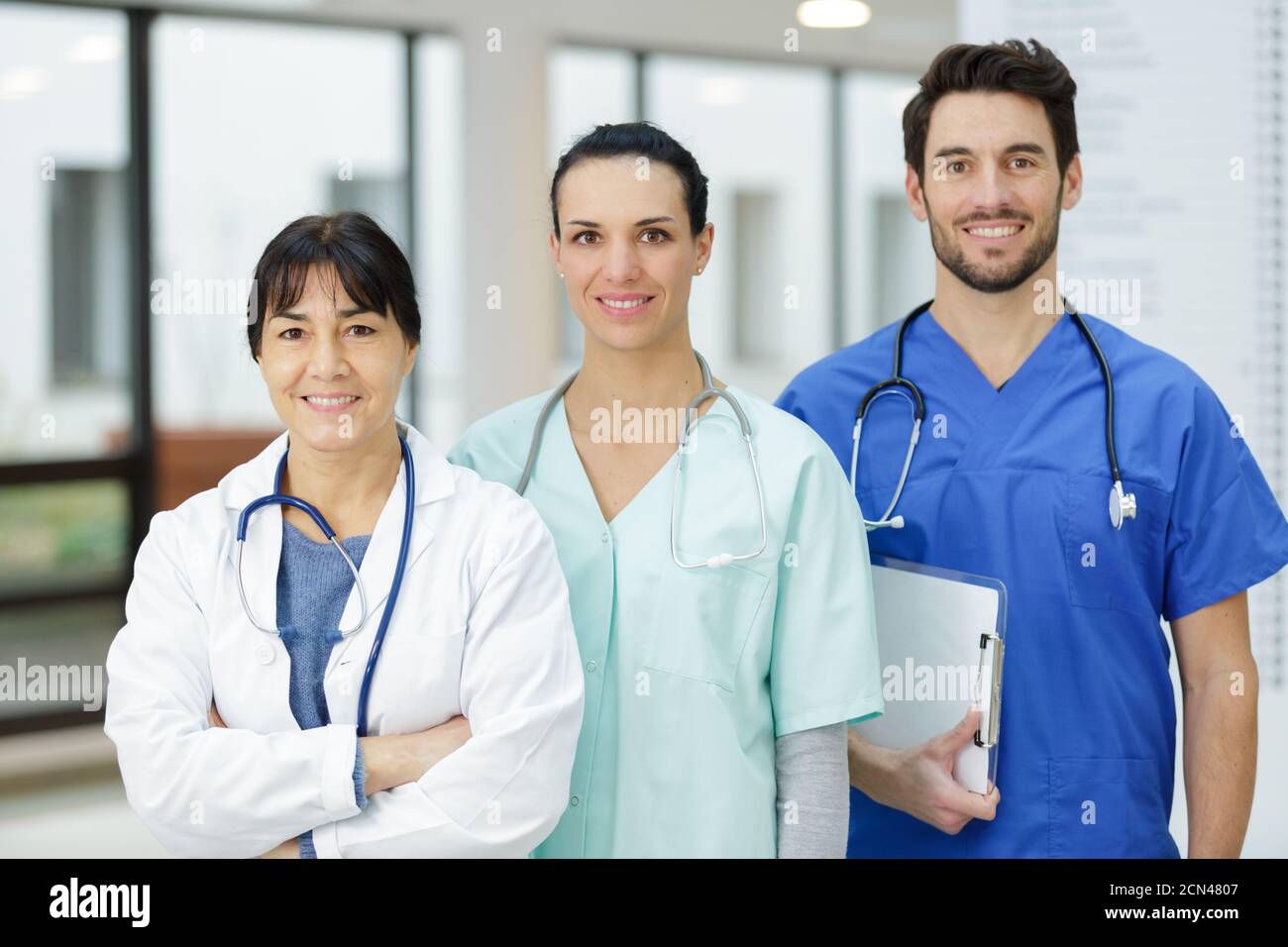 medical practitioners and young surgeons looking at camera Stock Photo ...