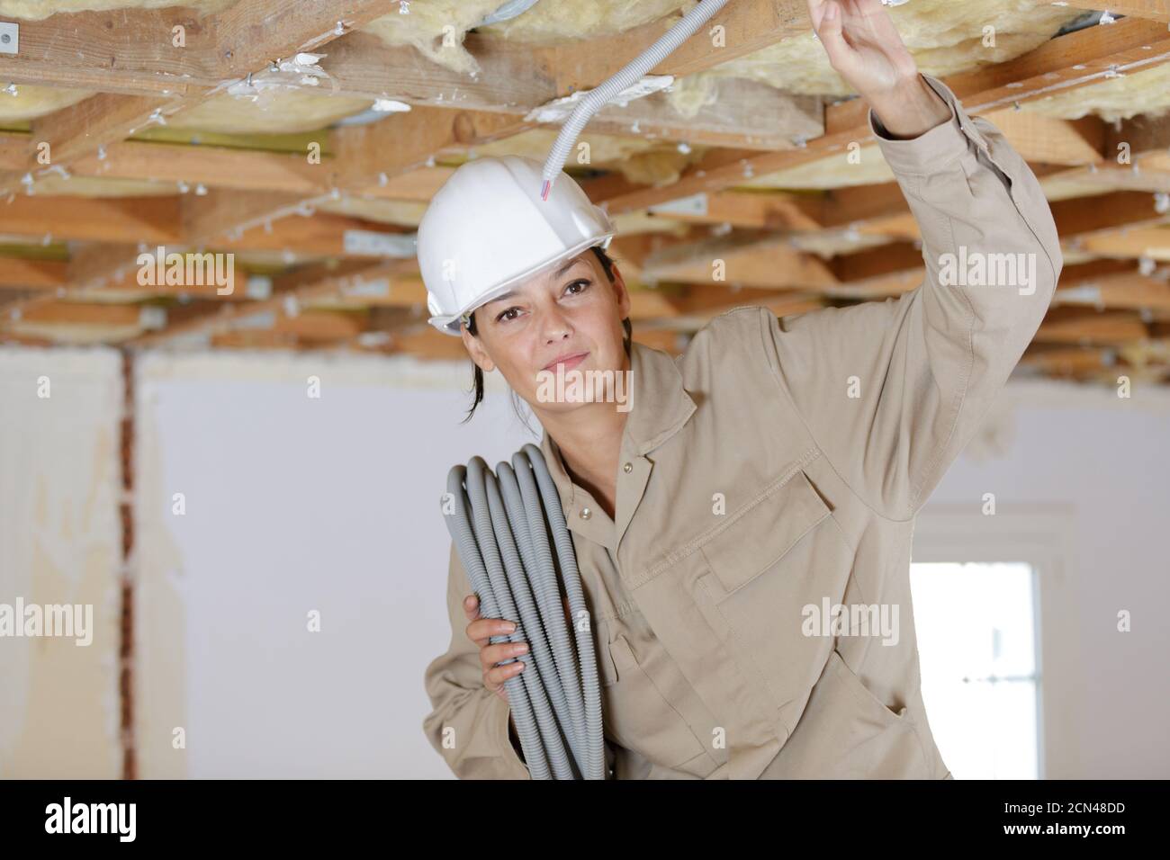 Female electrician fixing wire hi-res stock photography and images - Alamy