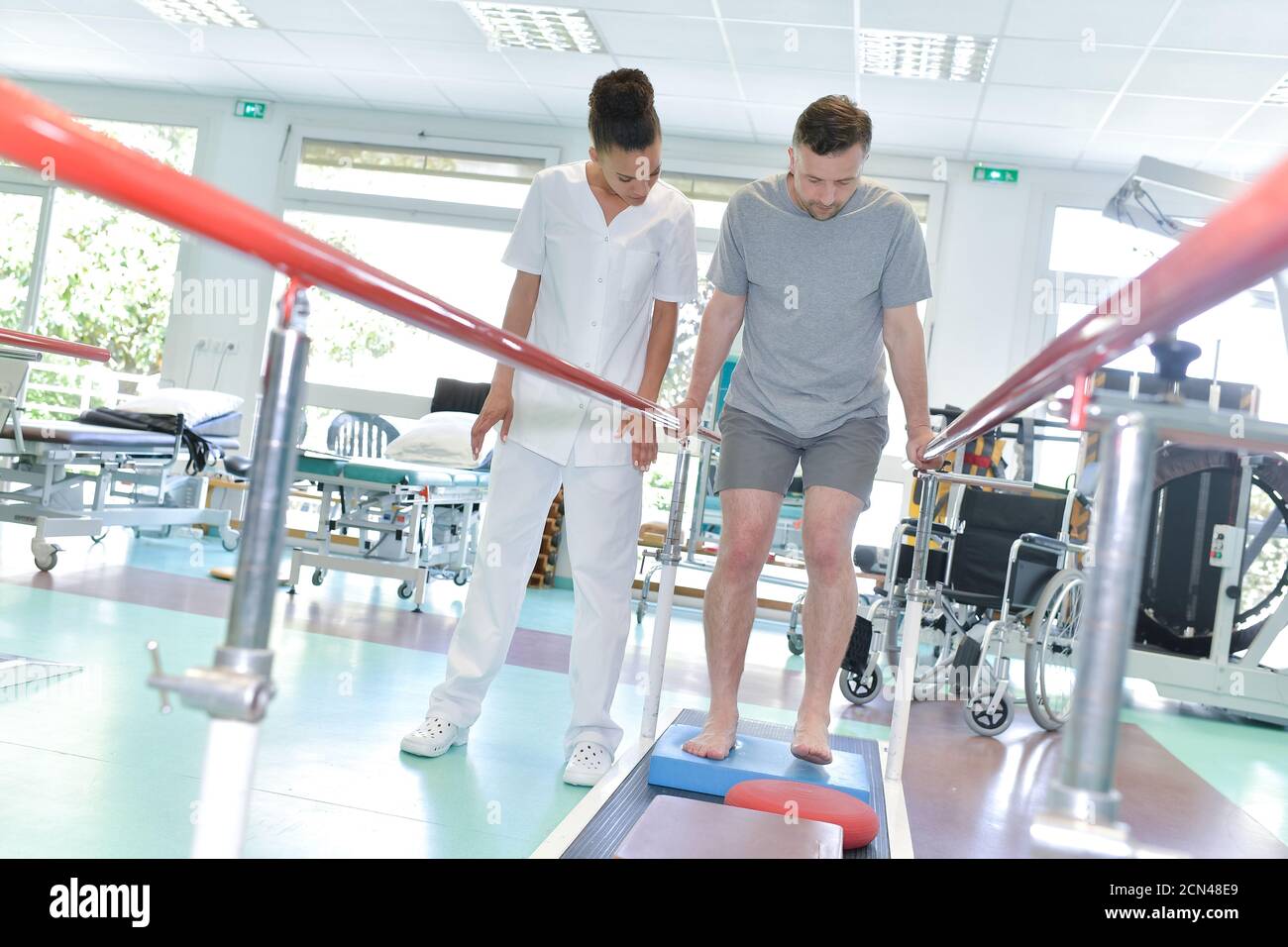 man on walking rehabilitation therapy Stock Photo - Alamy
