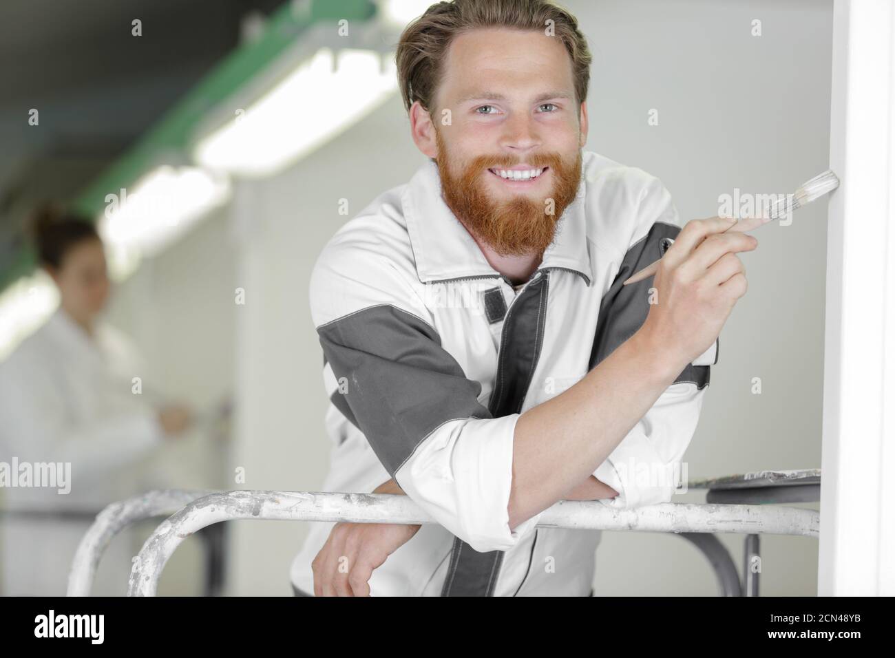 happy male painter at work Stock Photo - Alamy
