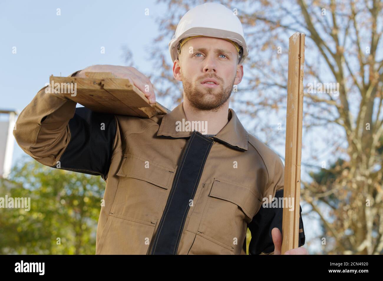 Workman carrying sign hi-res stock photography and images - Alamy