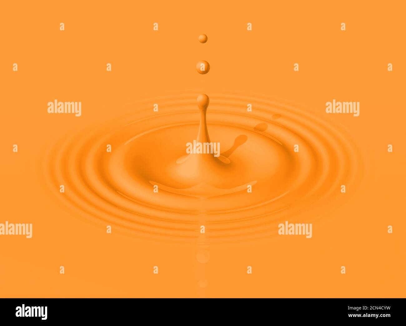Drop of orange milkshake and ripple Stock Photo - Alamy