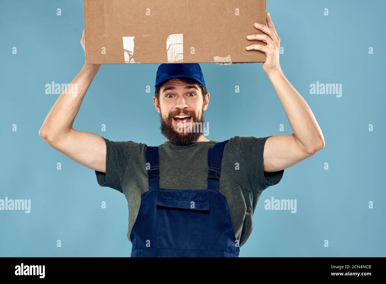 working man boxes in hands delivery service packaging lifestyle blue ...