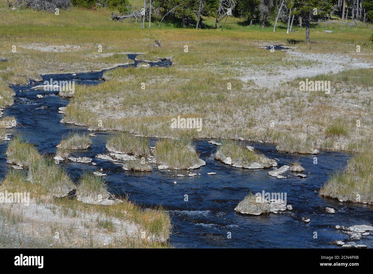 Scalding water flowing in a thermal desert at Upper Geyser Basin in ...