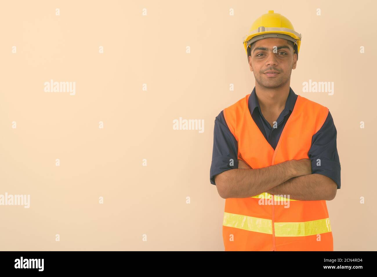 Young Indian man construction worker against white background Stock ...