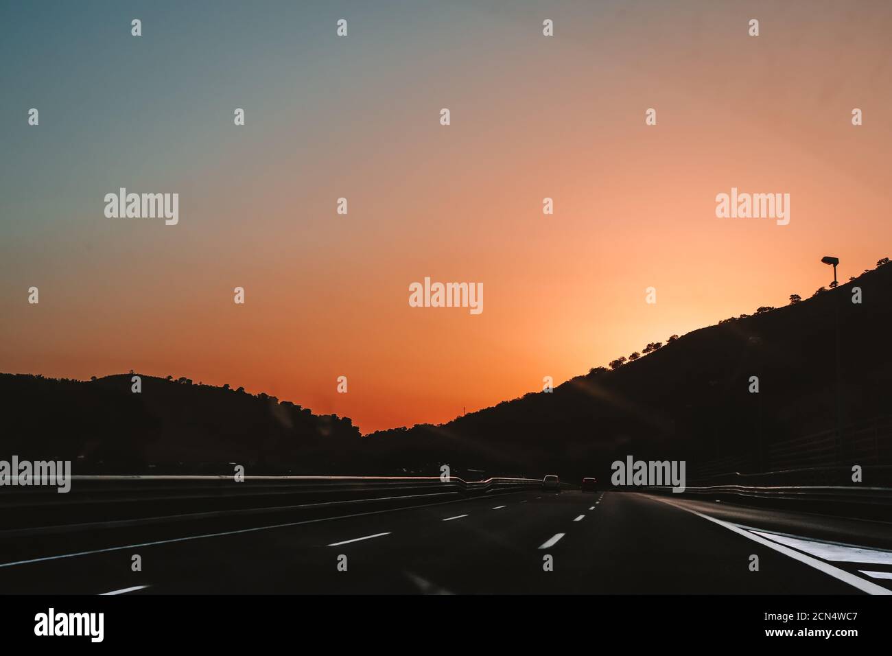 Roadtrip. Beautiful Sunrise with pink and blue clean sky on highway ...