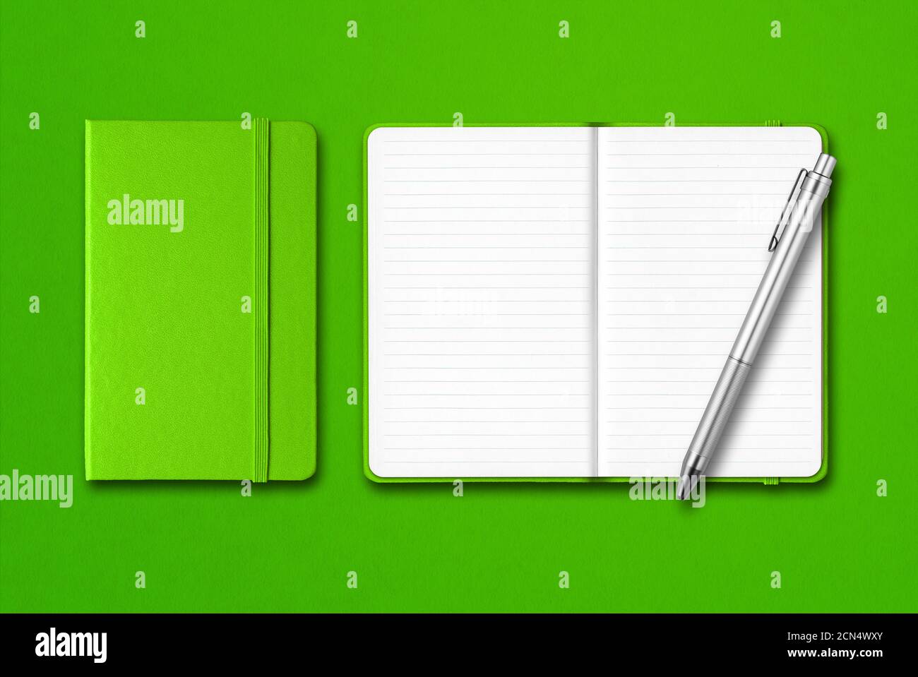 Green closed and open notebooks with a pen isolated on colorful ...