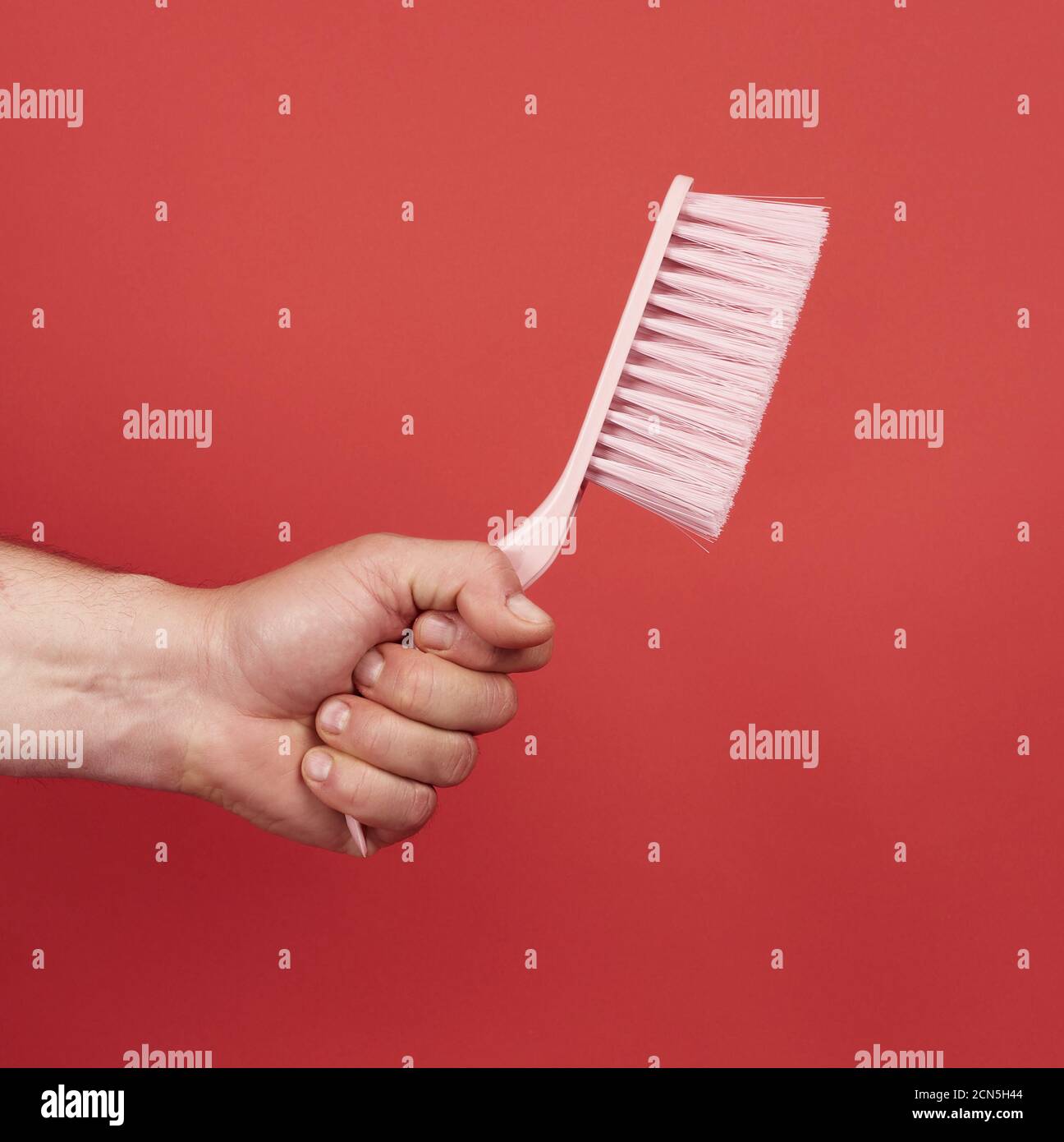 Hand holds pink cleaning hi-res stock photography and images - Alamy