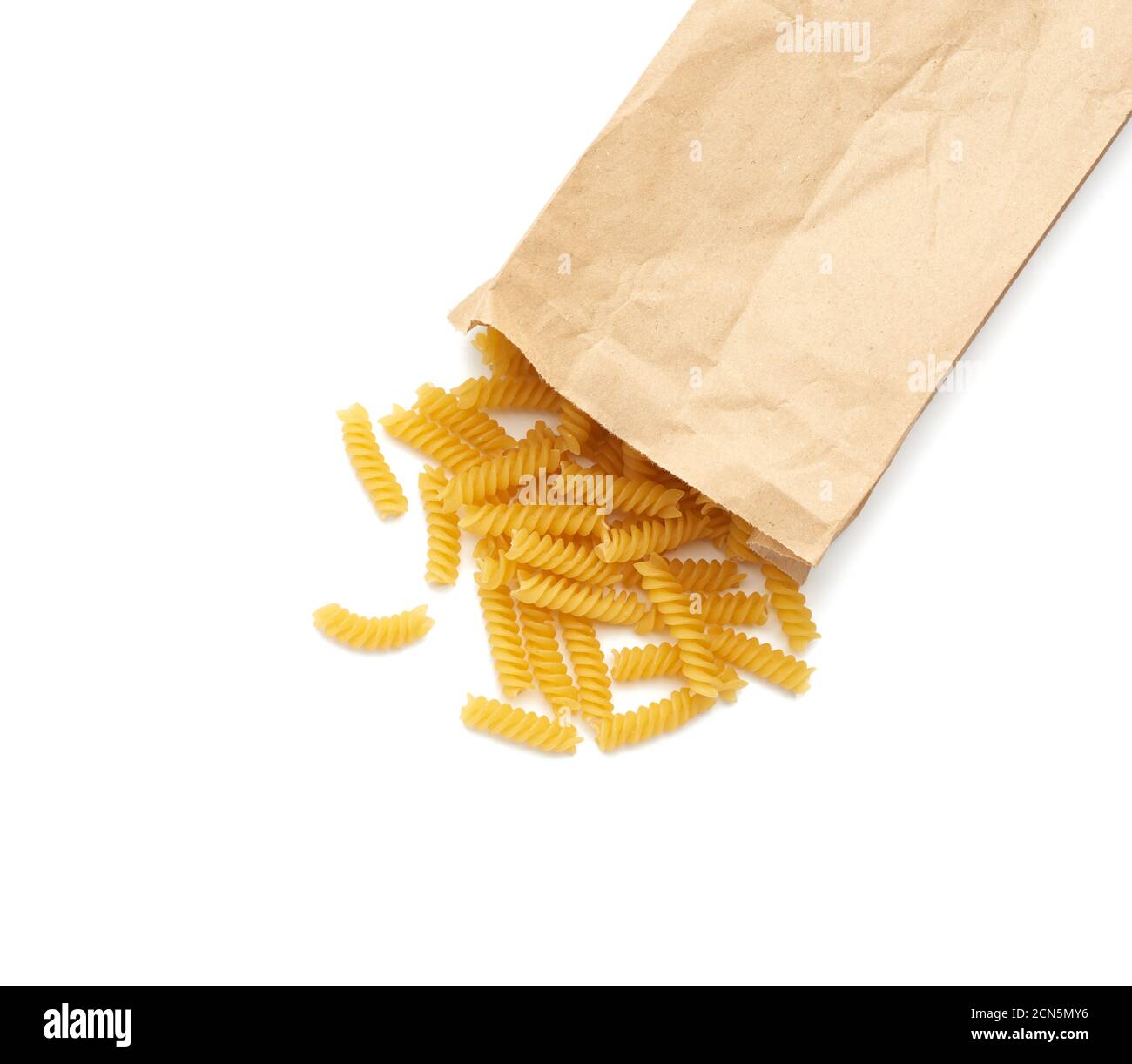 sprinkled raw fusilli pasta from brown paper bag Stock Photo - Alamy