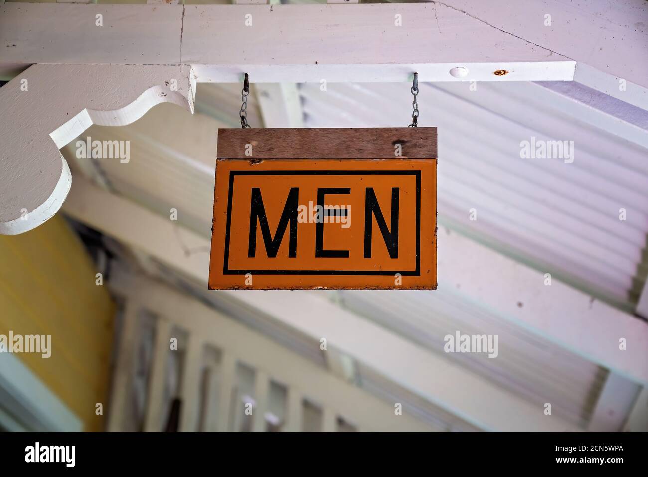 Vintage signage hanging from the ceiling indicating male bathroom Stock ...