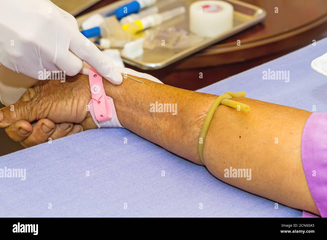 A nurse open intravenous fluid patient for injection Stock Photo - Alamy